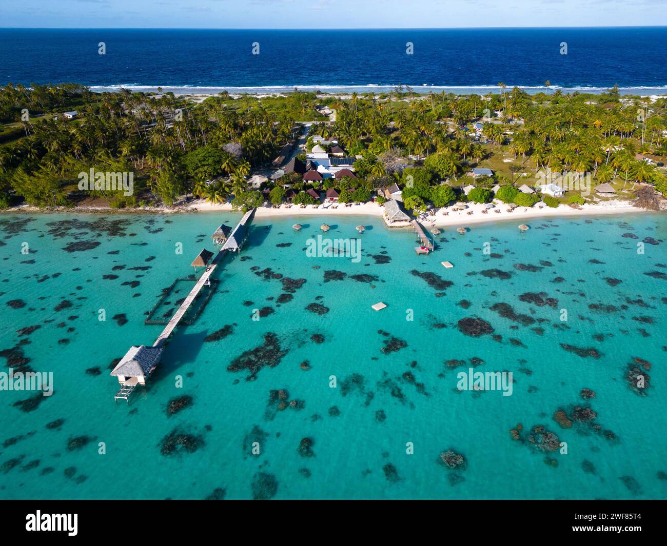 Aerial view of Havaiki Lodge showing lagoon and pacific ocean of ...