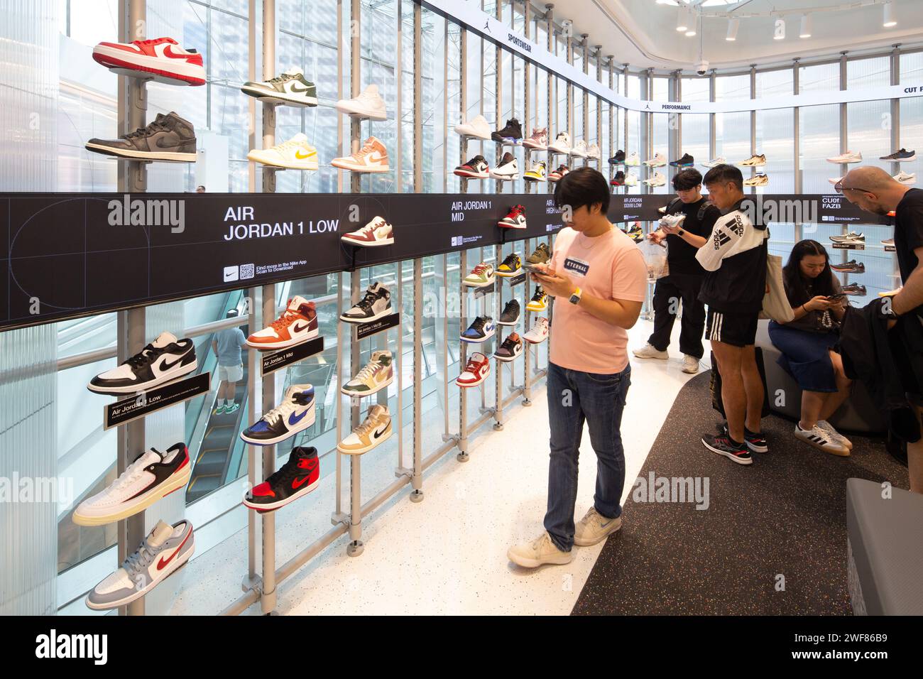 Visitors are checking out Air Jordan 1 sneakers selection inside the ...