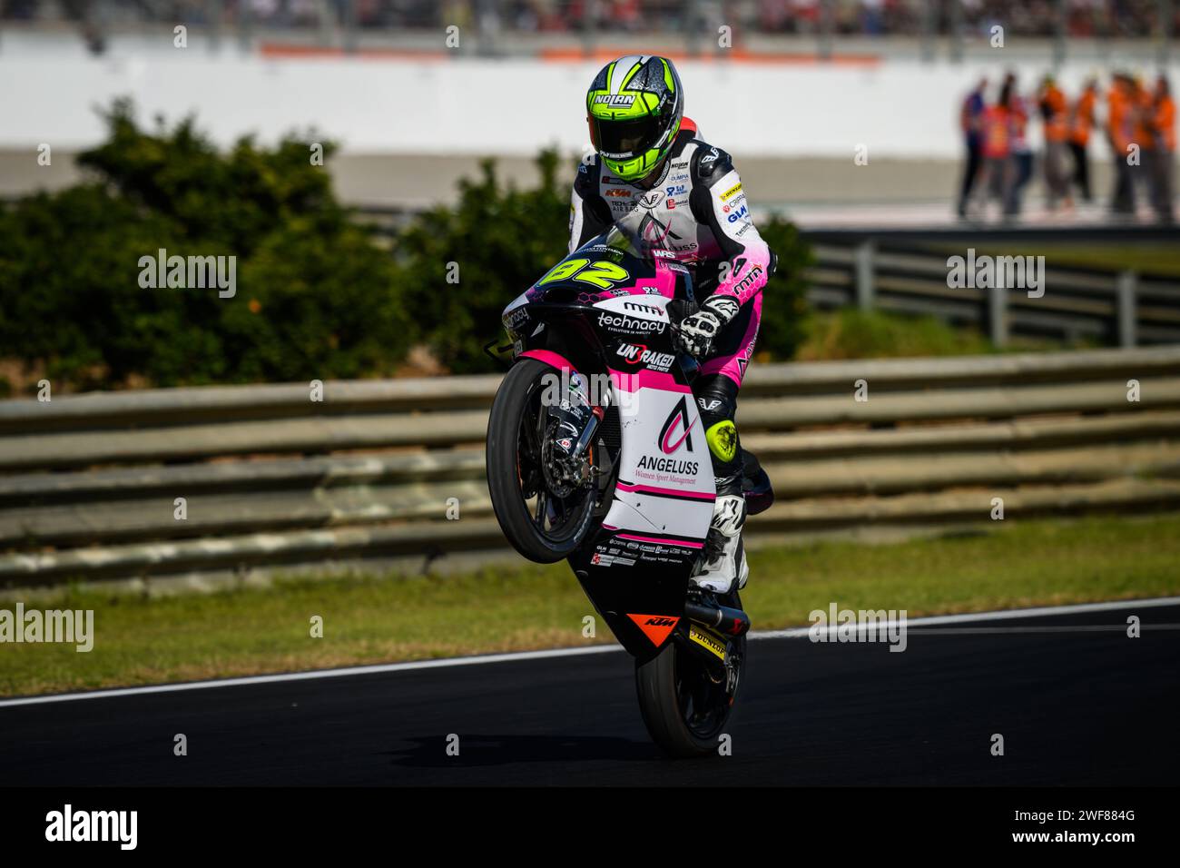 Italian Moto3 rider Stefano Nepa doing a wheelie at the end of the ...