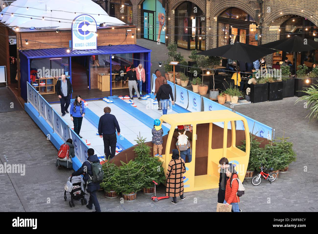 Kings Cross fun winter activity, curling, in Coal Drops Yard, north ...