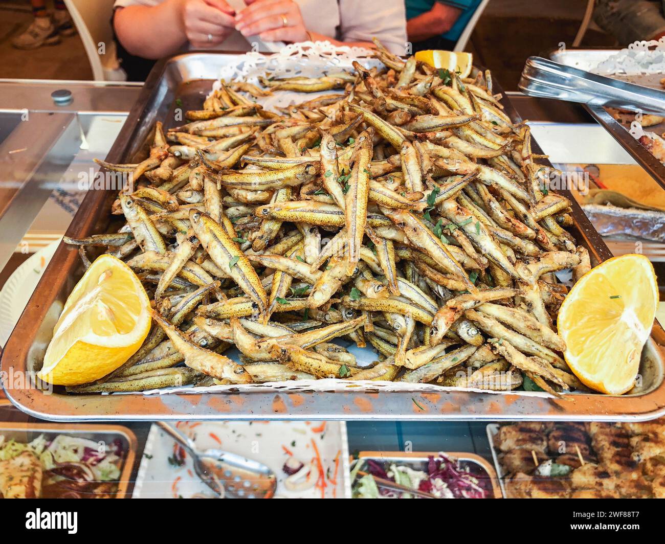 Fried anchovies fish with lemon. Mediterranean diet food. Fried fishes ...