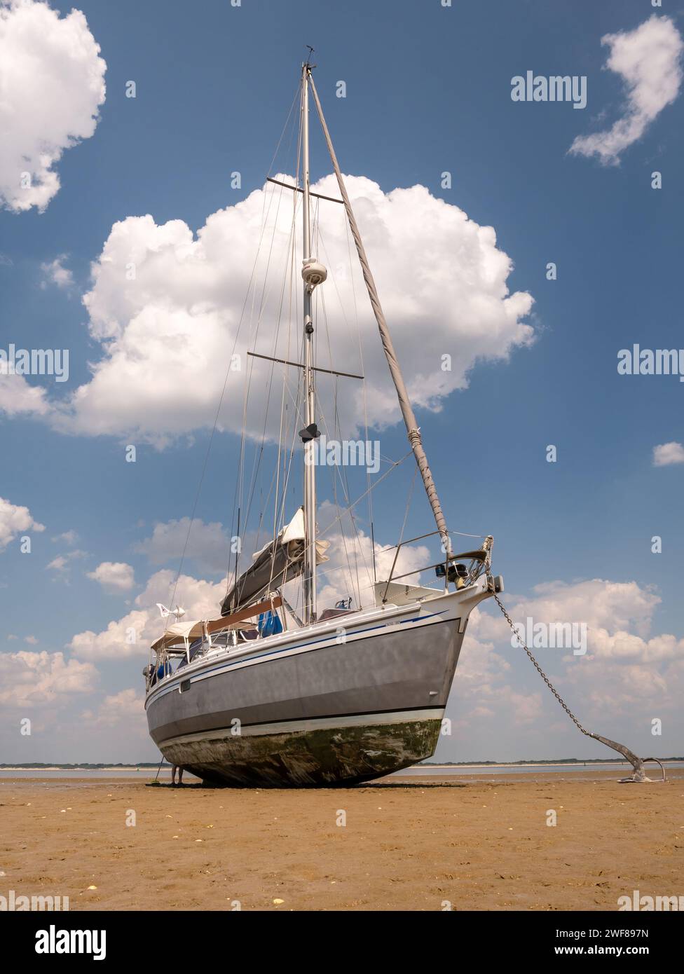 Sailboat dried out on tidal flats at low tide, Kwade Hoek nature ...