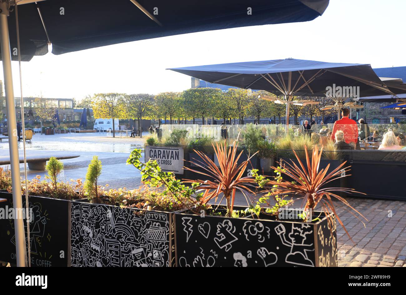 Trendy Caravan restaurant in winter sunshine on Granary Square, at ...