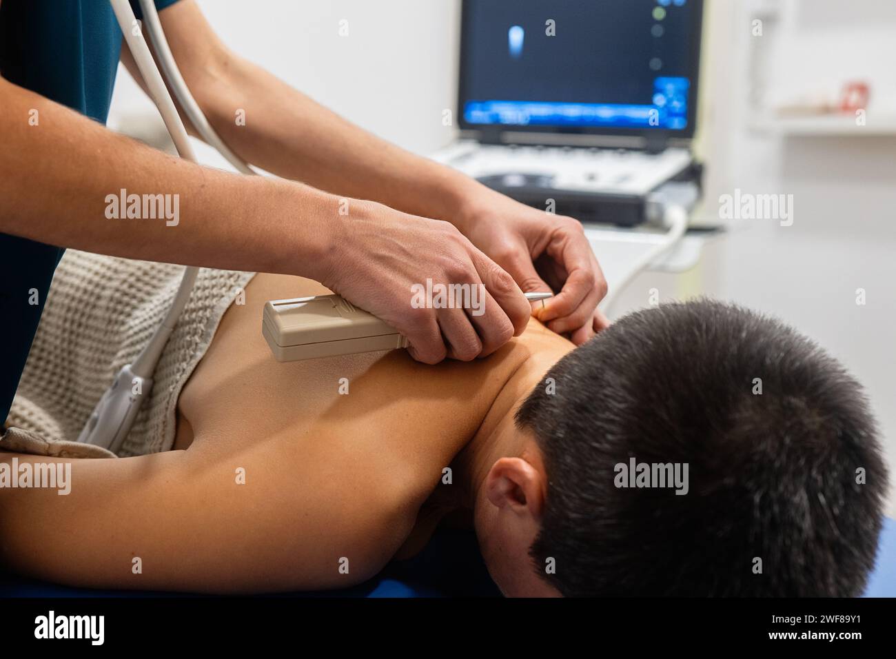 Doctor performs diagnostic scan hi-res stock photography and images - Alamy