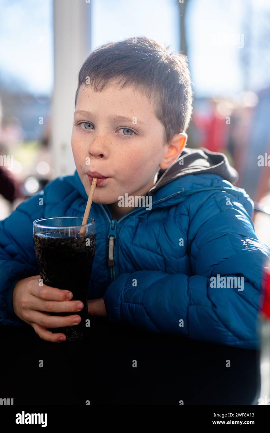 Sipping drink through straw hi-res stock photography and images - Alamy