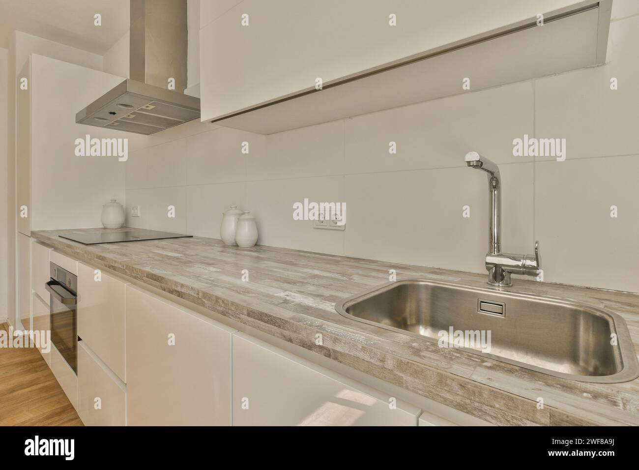 An elegant modern kitchen featuring sleek marble countertops, a ...