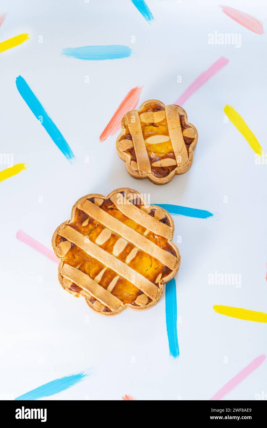 Two Italian Easter pastiera napoletana tarts on a white background with ...
