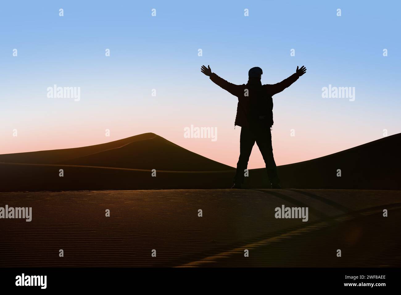 Back view of unrecognizable silhouette of an adventurer person with ...