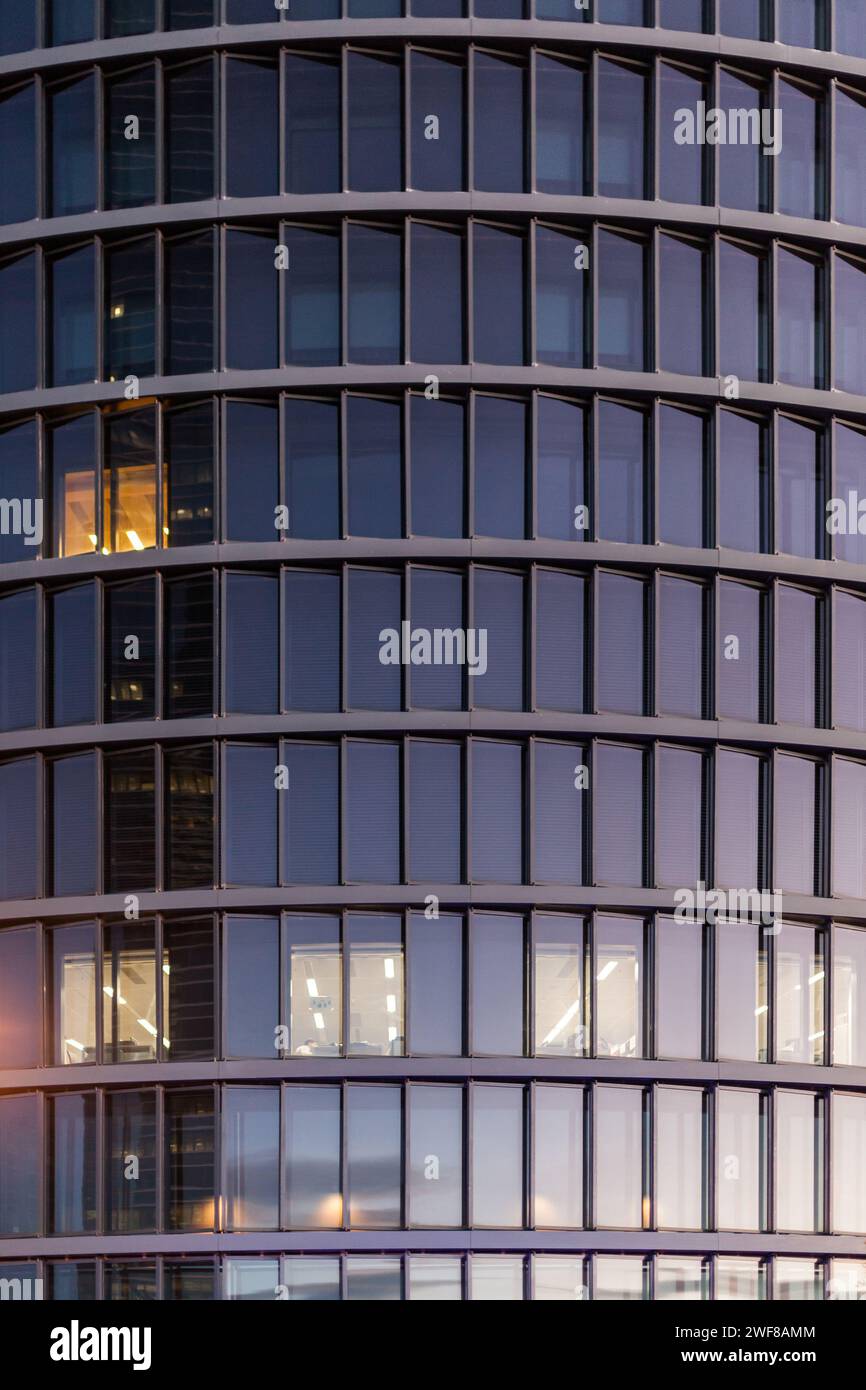 Close-up of a modern office building's glass facade with reflective ...
