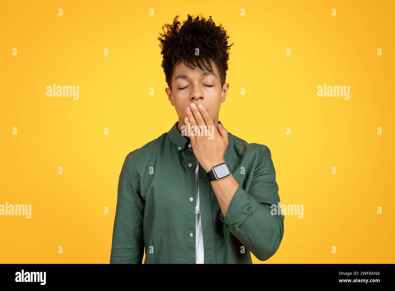 Sleepy young black guy yawning with closed eyes Stock Photo - Alamy