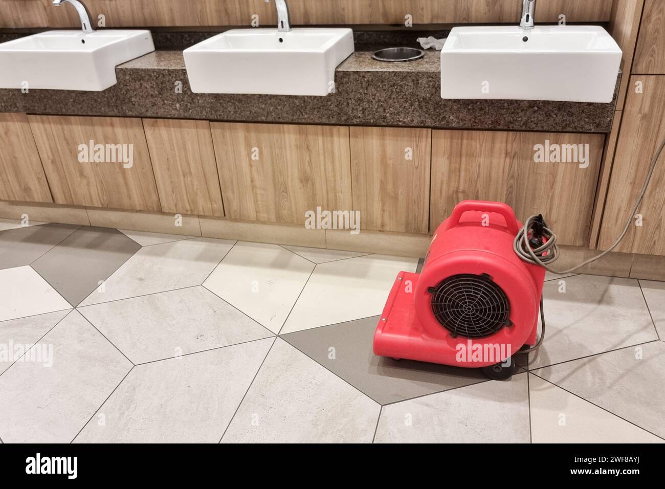 Floor dryer fan used in public washroom and toilet to dry the floor ...
