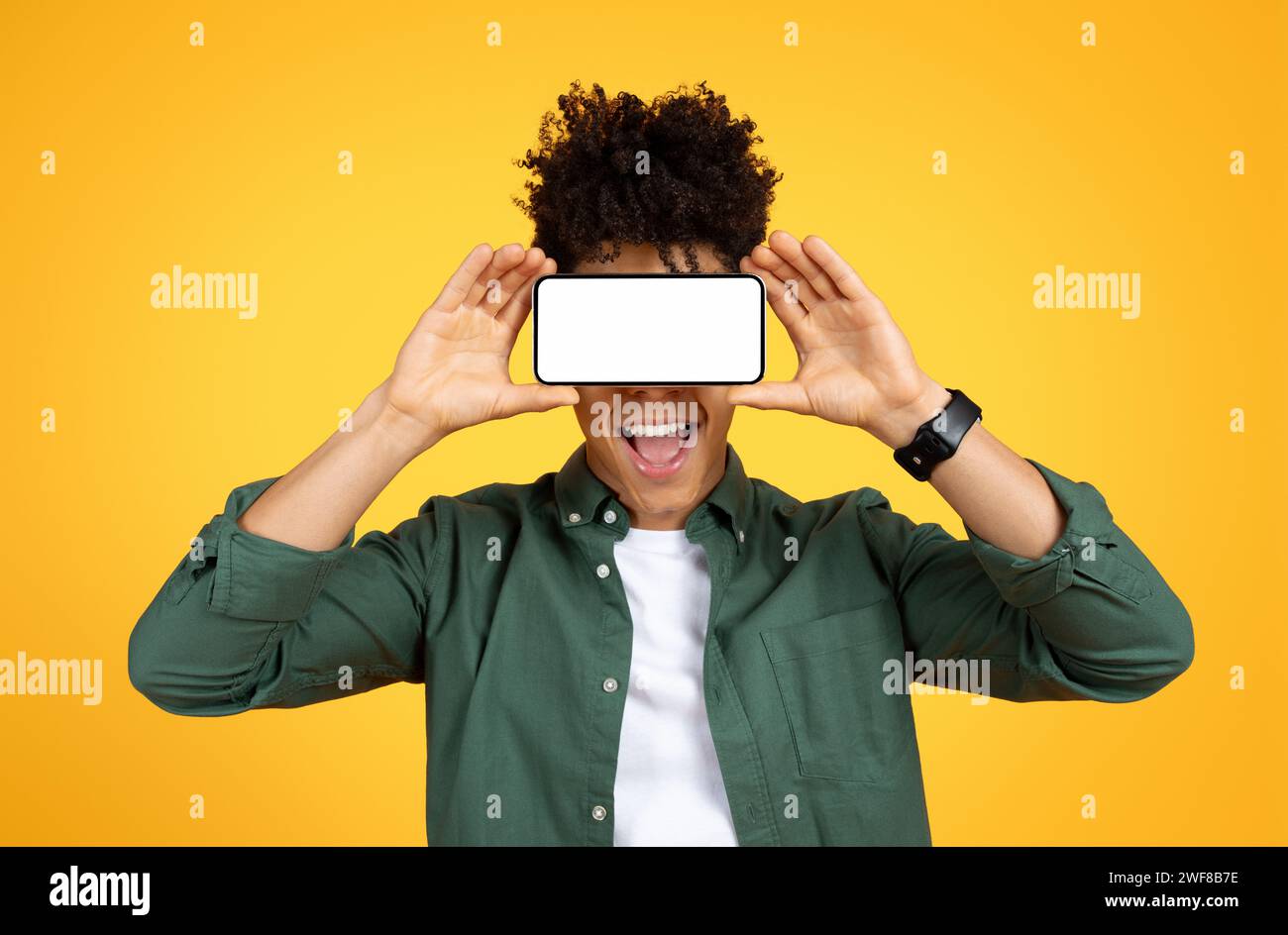 Black guy holding smartphone with white screen over his eyes Stock ...
