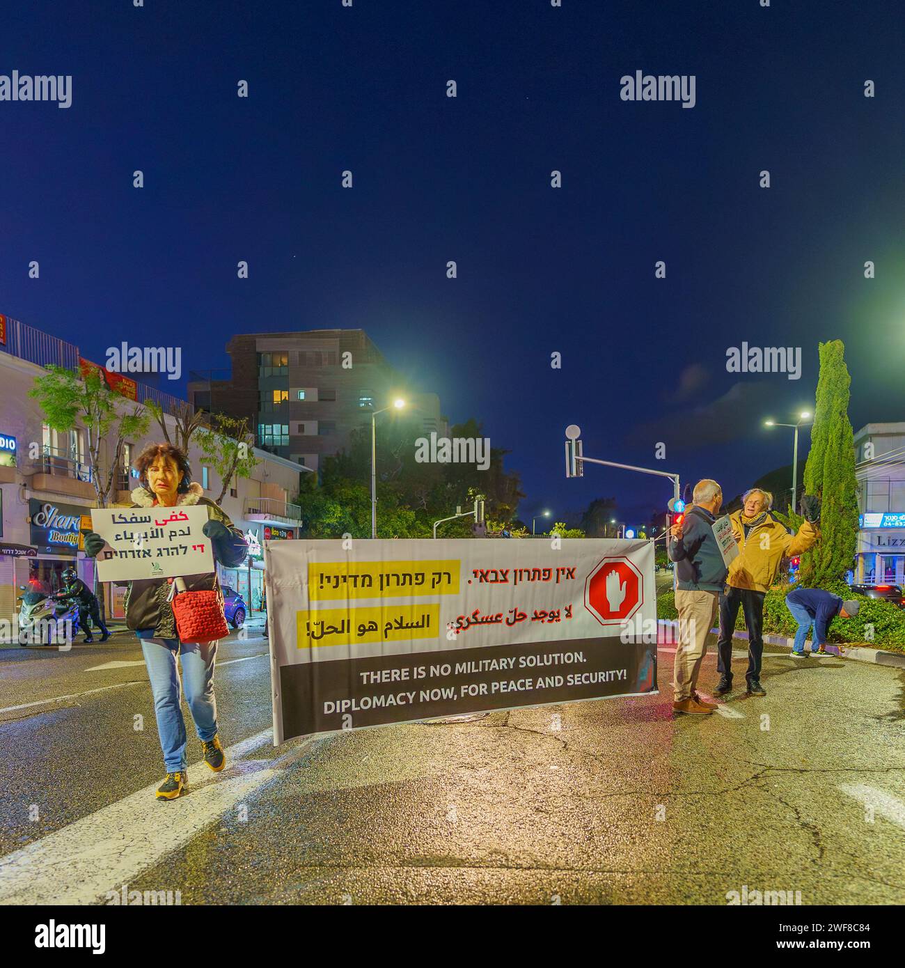 Haifa, Israel - January 27, 2024: People with signs calling for peace ...