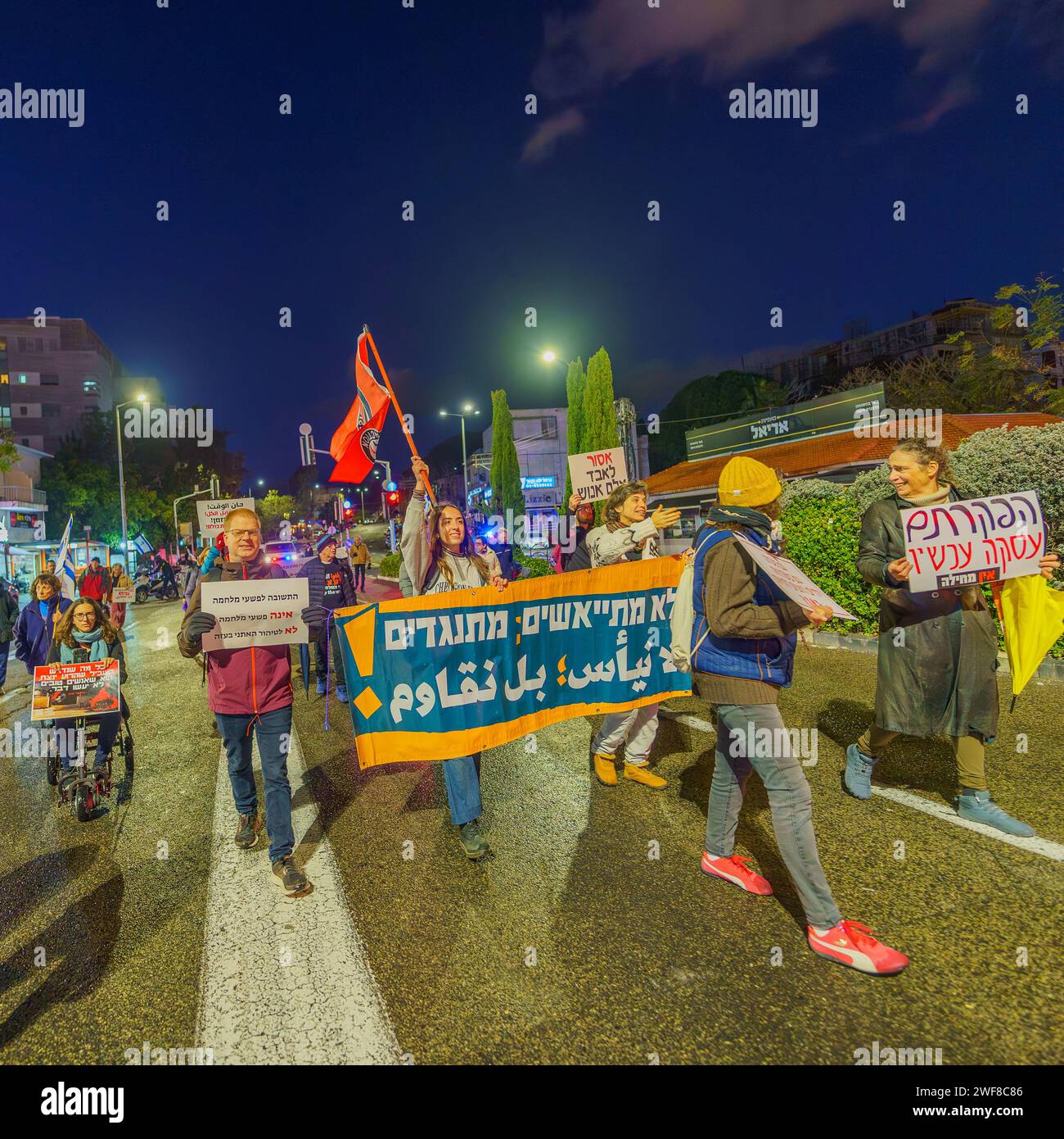 Haifa, Israel - January 27, 2024: People with signs calling for peace ...