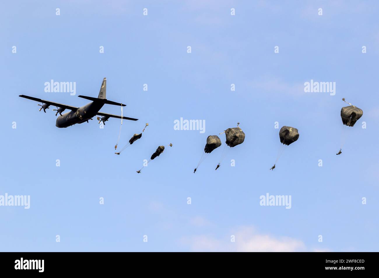 NATO military parachutist paratroopers parachute jumping out of a ...