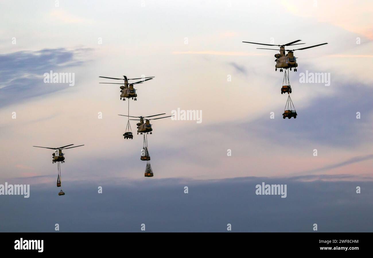 US Army Boeing CH-47F Chinook transport helicopters with a slingload ...