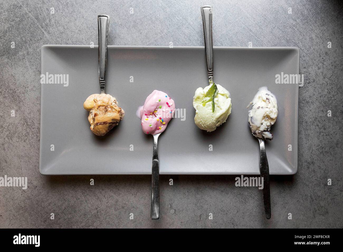 Top view of four spoons with various ice cream flavors. Soft view Stock ...