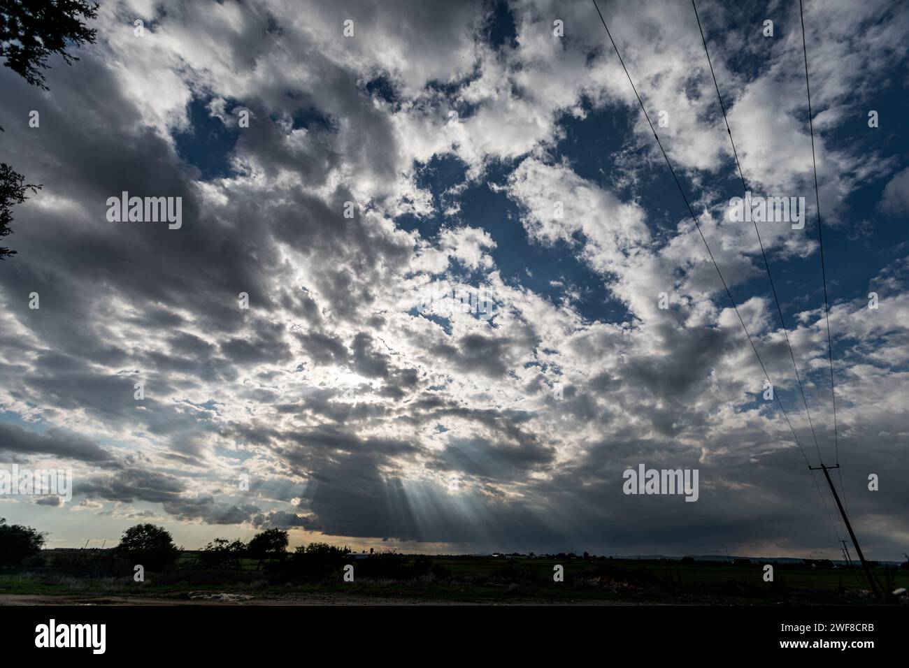 Avgorou, Cyprus. 28th Jan, 2024. Sun rays are coming through the clouds ...