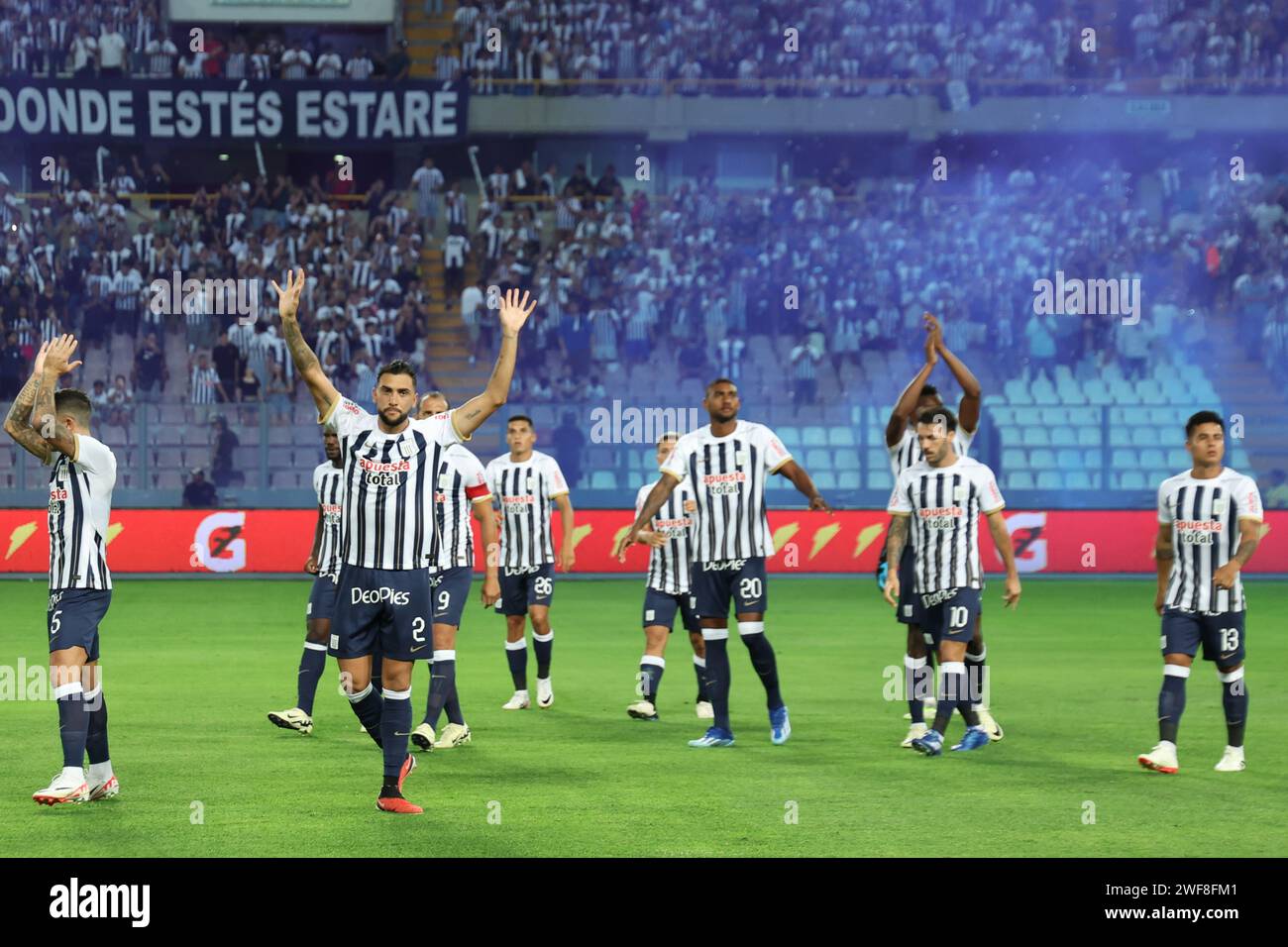 Alianza Lima players getting the fans during the Liga 1 match between ...