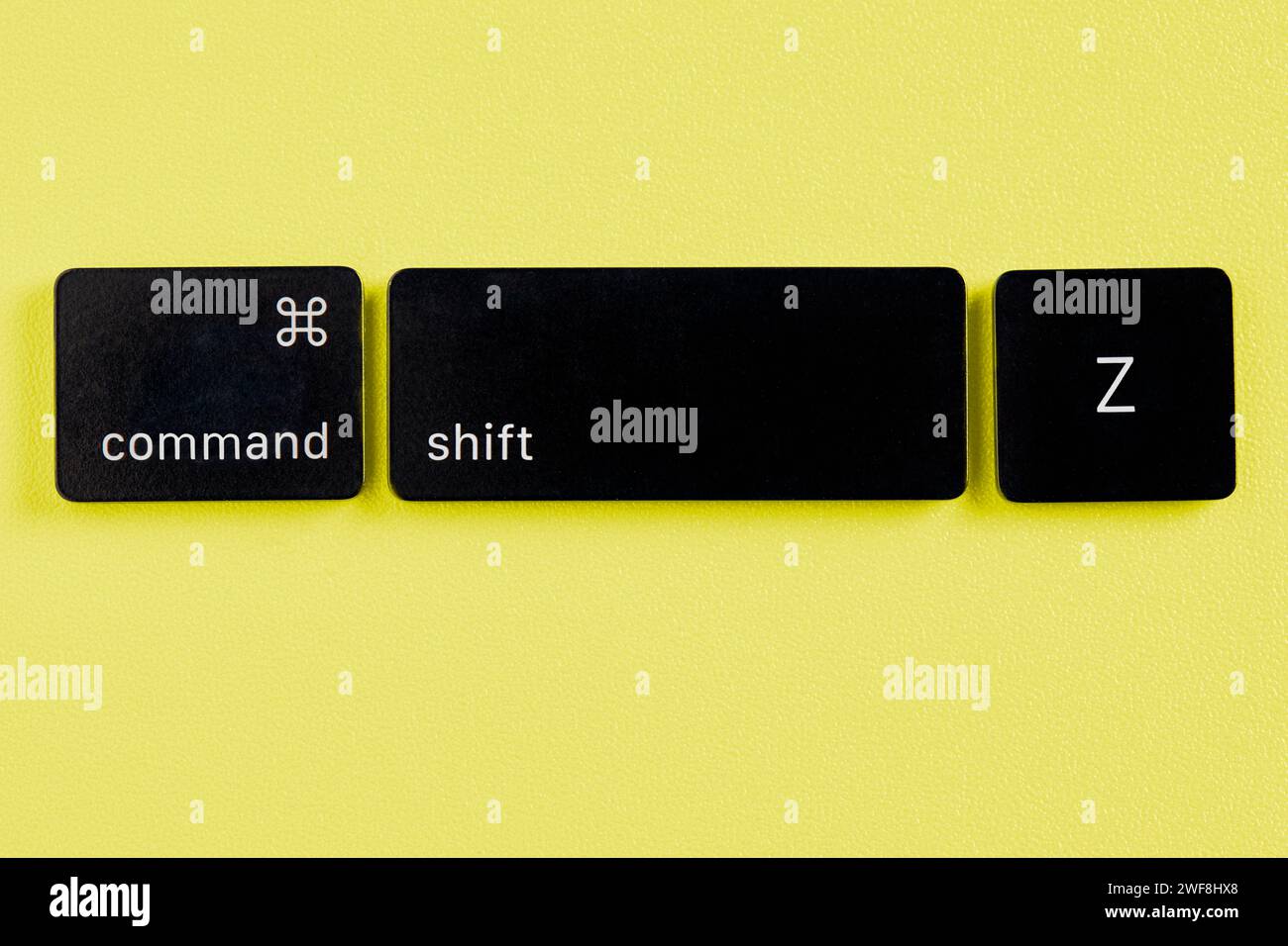The command key, shift key and Z key are removed from a keyboard with ...