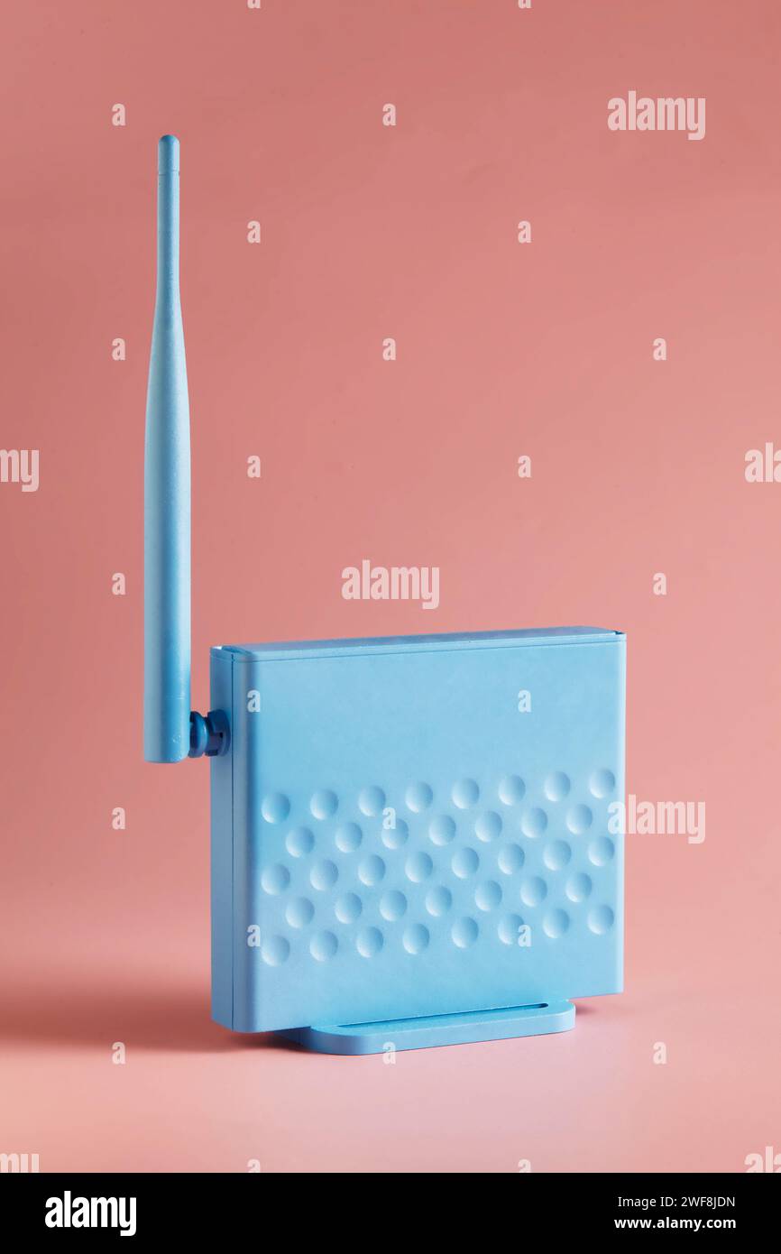 A soft blue router on pink background Stock Photo - Alamy