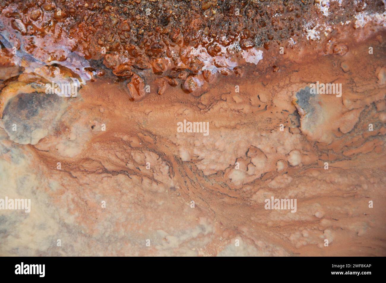 polluted and colored soil of an old carrer Stock Photo - Alamy