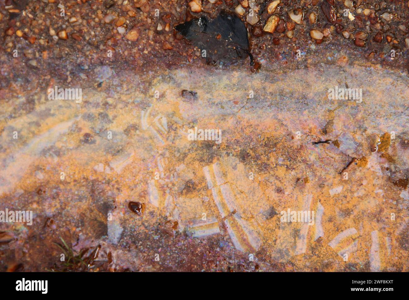 polluted and colored soil of an old carrer Stock Photo - Alamy
