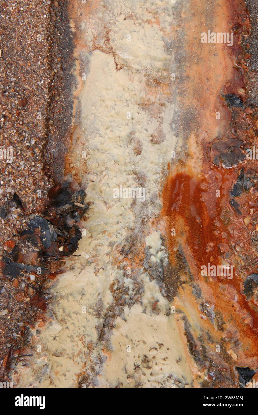 polluted and colored soil of an old carrer Stock Photo - Alamy
