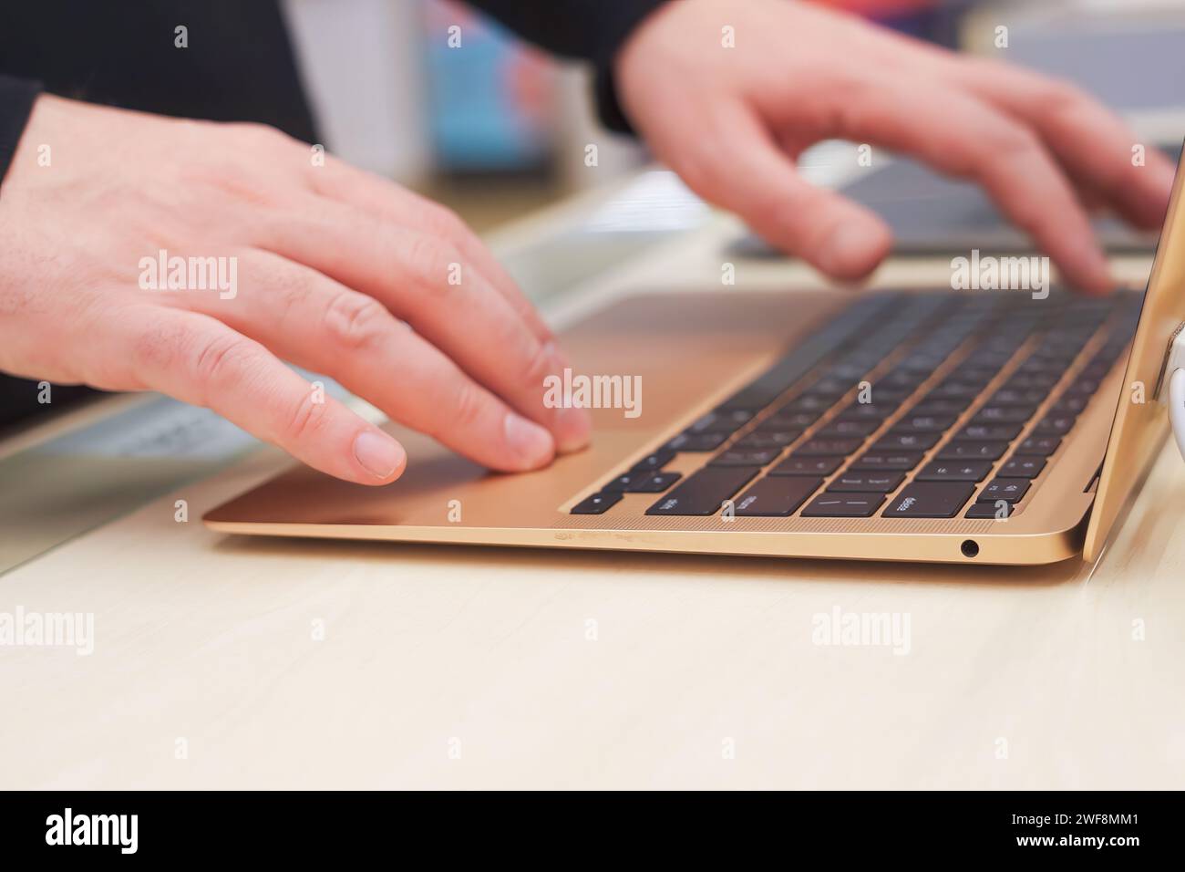 Buyer checking laptops in a computer store Stock Photo - Alamy