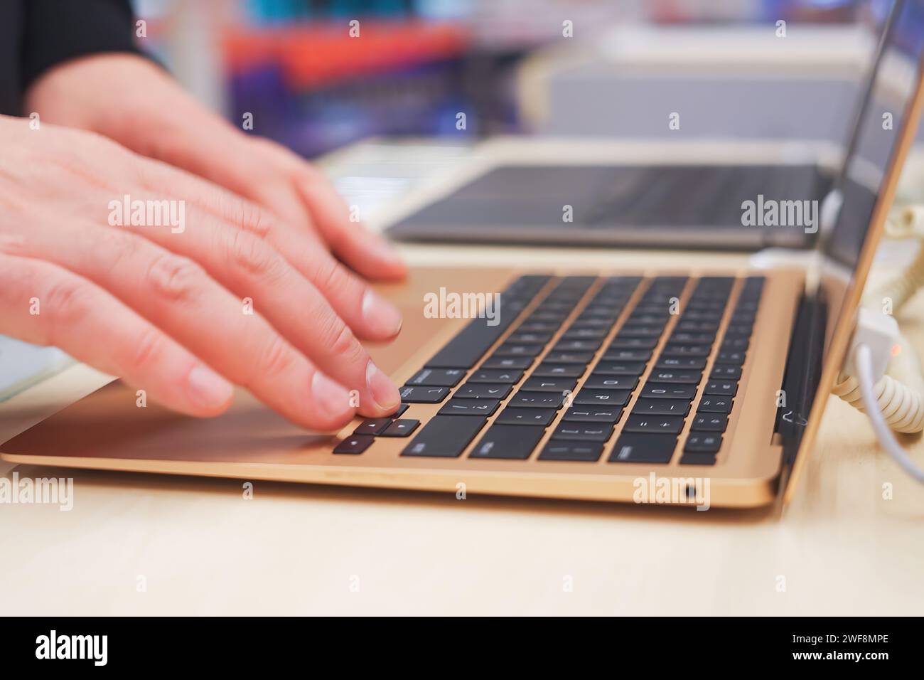 Buyer checking laptops in a computer store Stock Photo - Alamy
