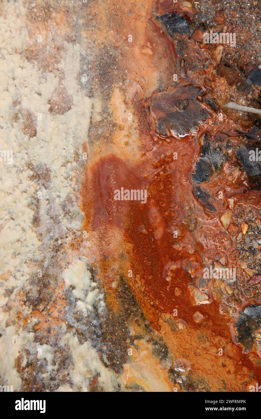 polluted and colored soil of an old carrer Stock Photo - Alamy