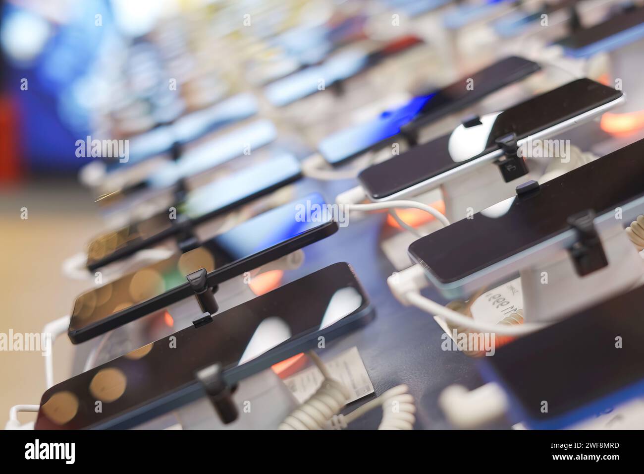 A lot of smartphone models on display at the exhibition stand of an ...