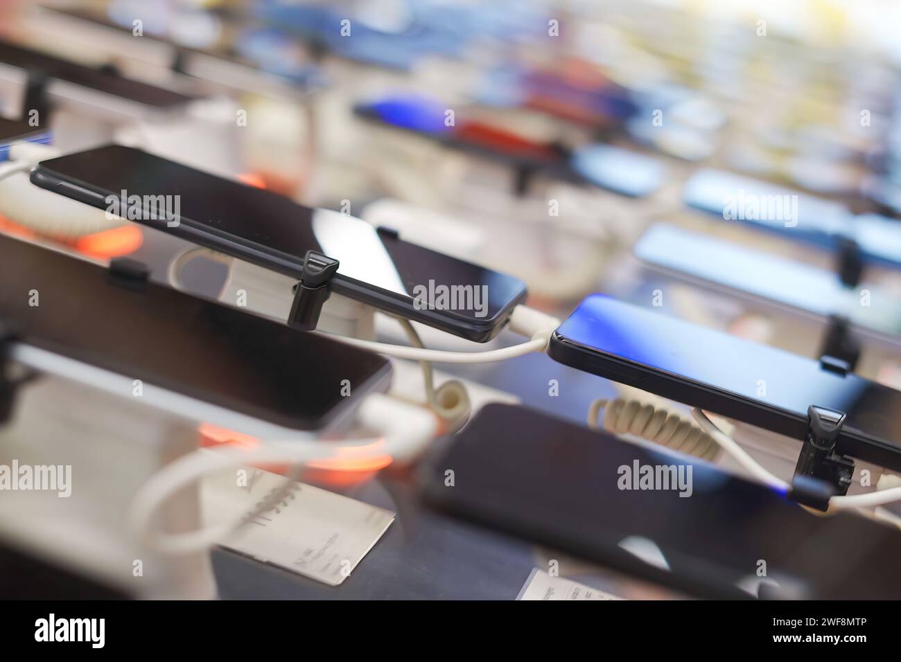 A lot of smartphone models on display at the exhibition stand of an ...