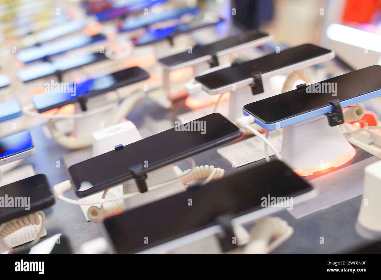 A lot of smartphone models on display at the exhibition stand of an ...