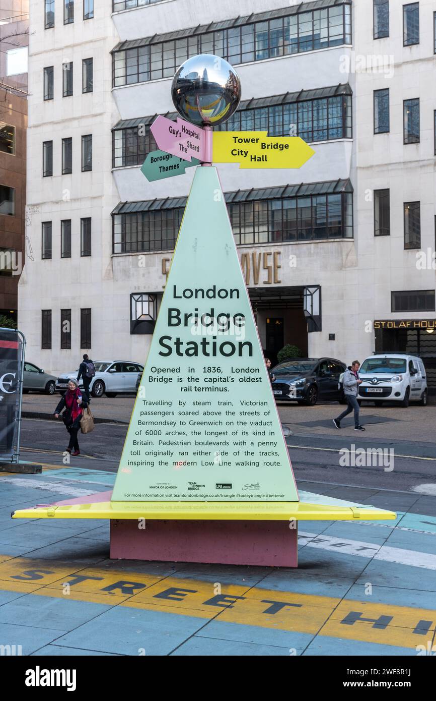 Tooley Street Triangle, street art and large signpost at London Bridge ...