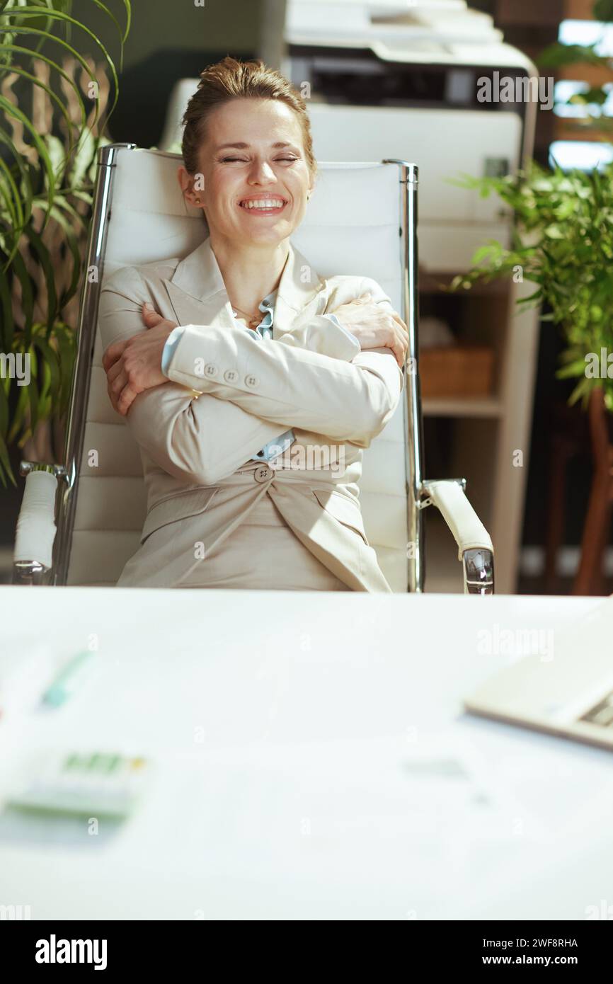 happy modern 40 years old bookkeeper woman in a light business suit in ...