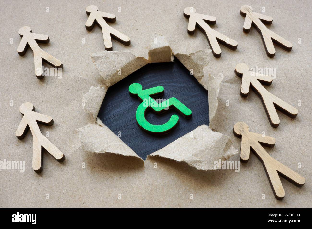 Social inclusion concept. Disabled person sign and figurines Stock ...