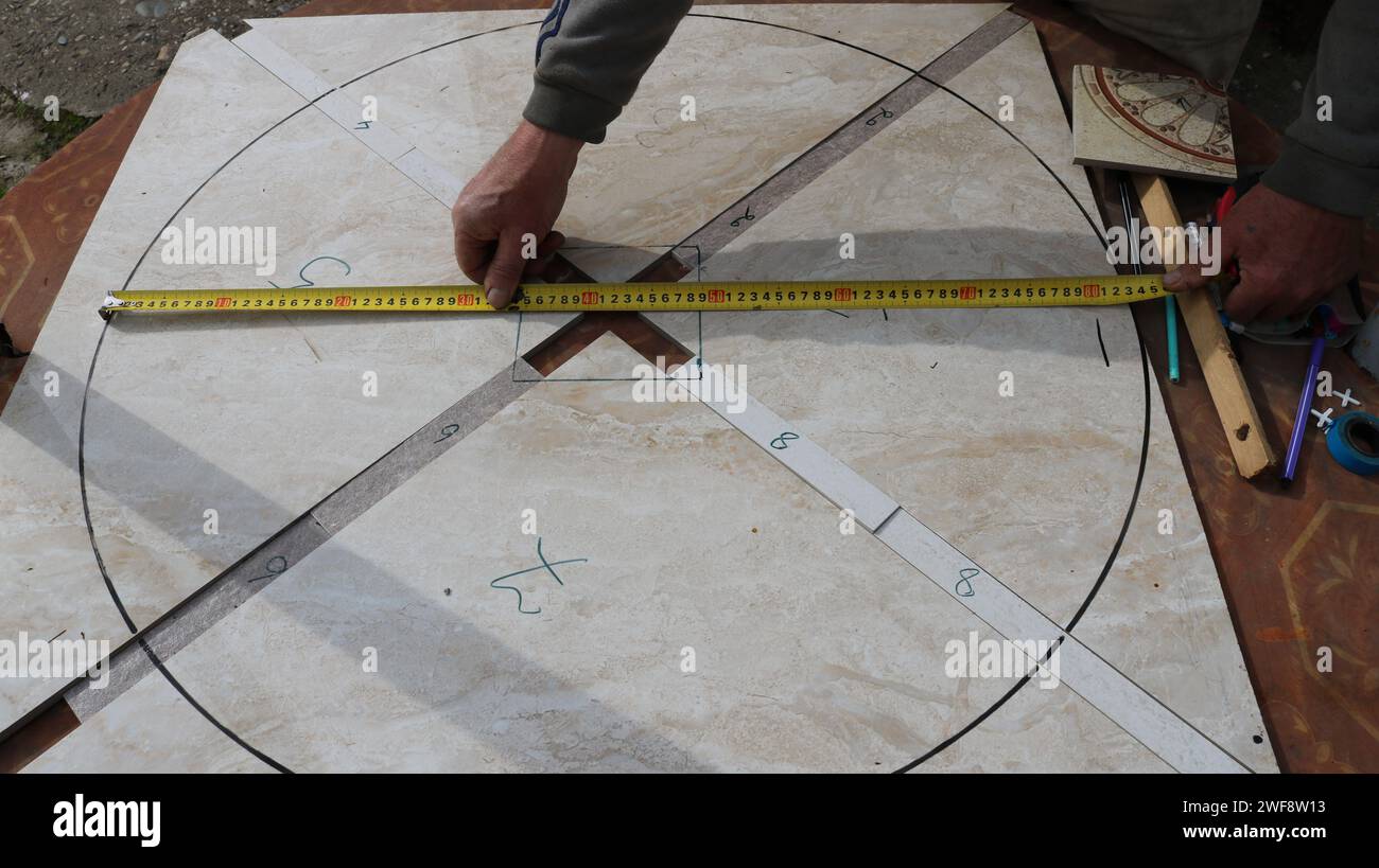 measuring the width of a drawn circle on a tiled surface of a craft ...