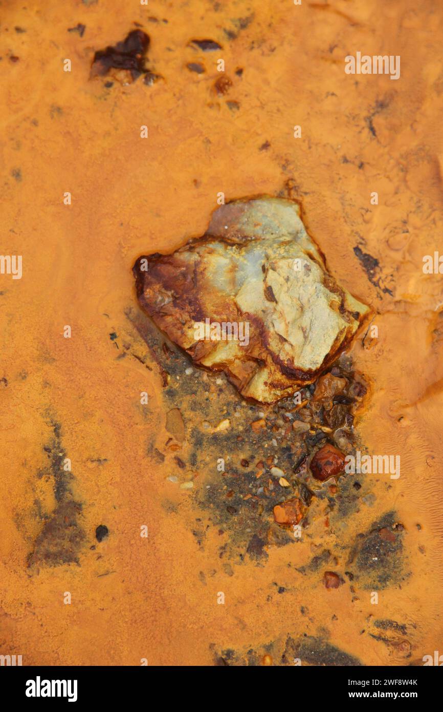 polluted and colored soil of an old carrer Stock Photo - Alamy