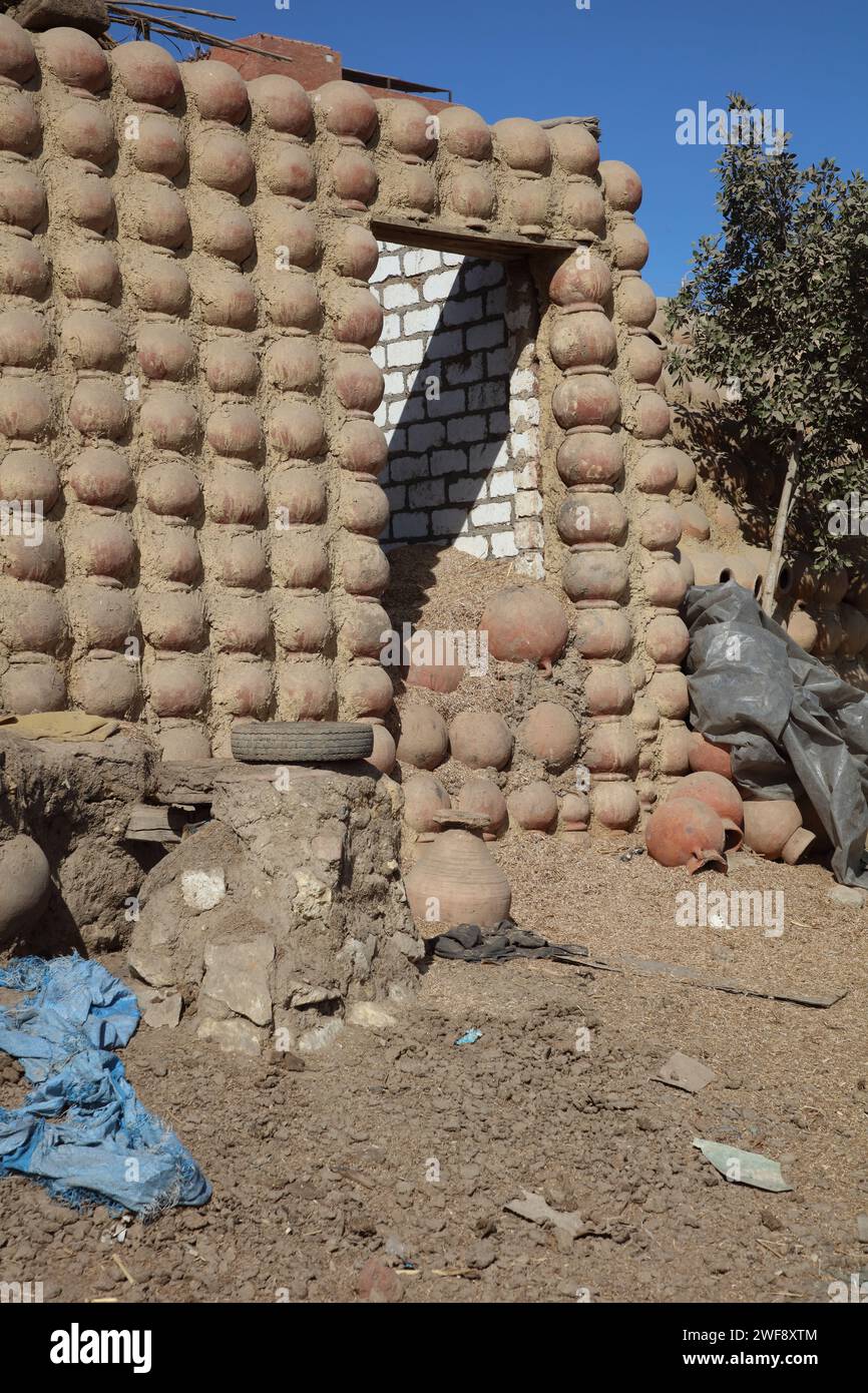 pottery, buildings, rubish in a village Stock Photo - Alamy