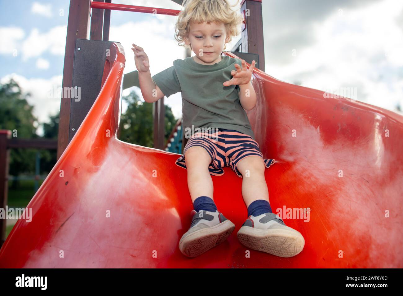 Children sliding hi-res stock photography and images - Alamy