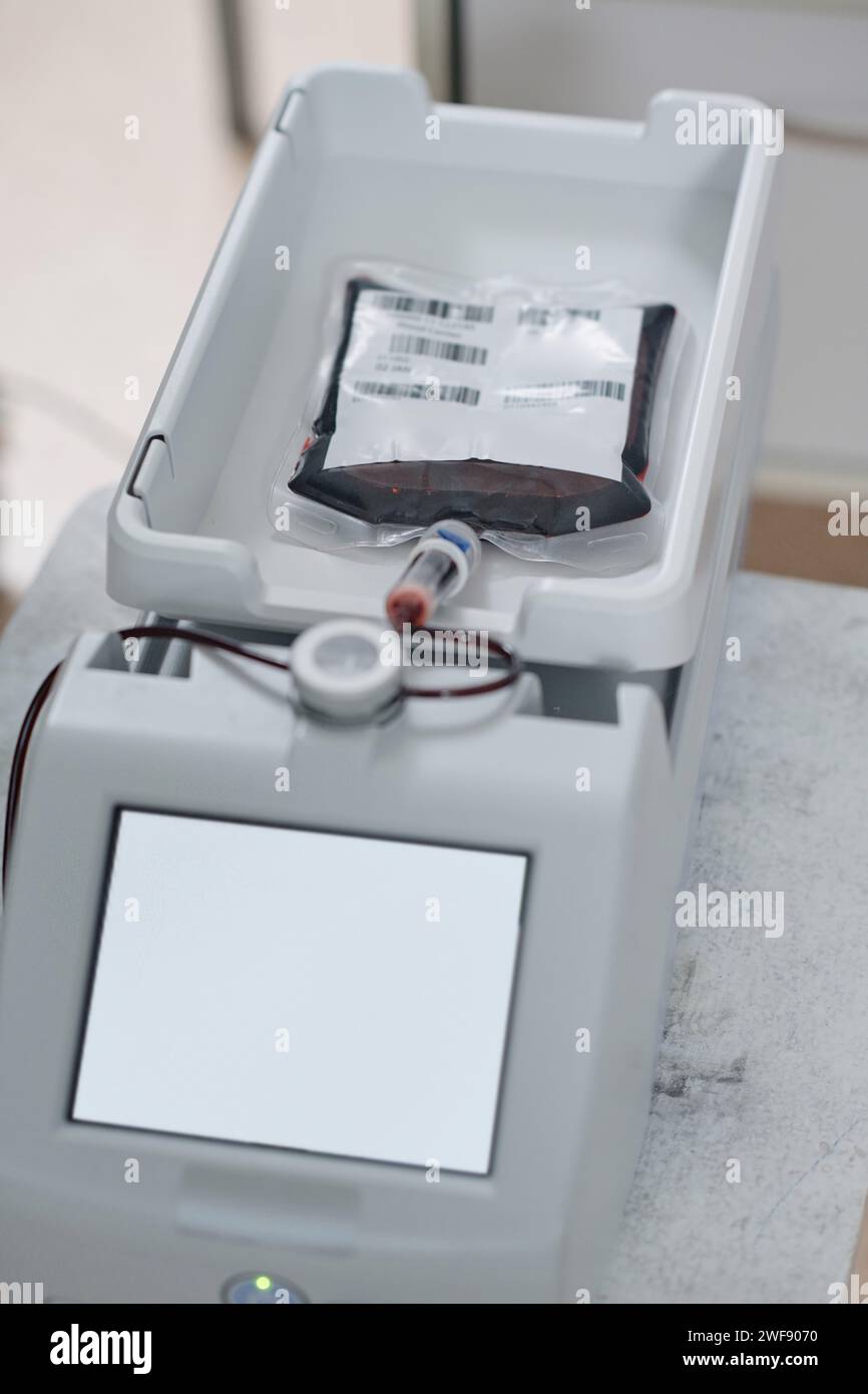 Package with blood placed on mixer machine with mockup display during ...
