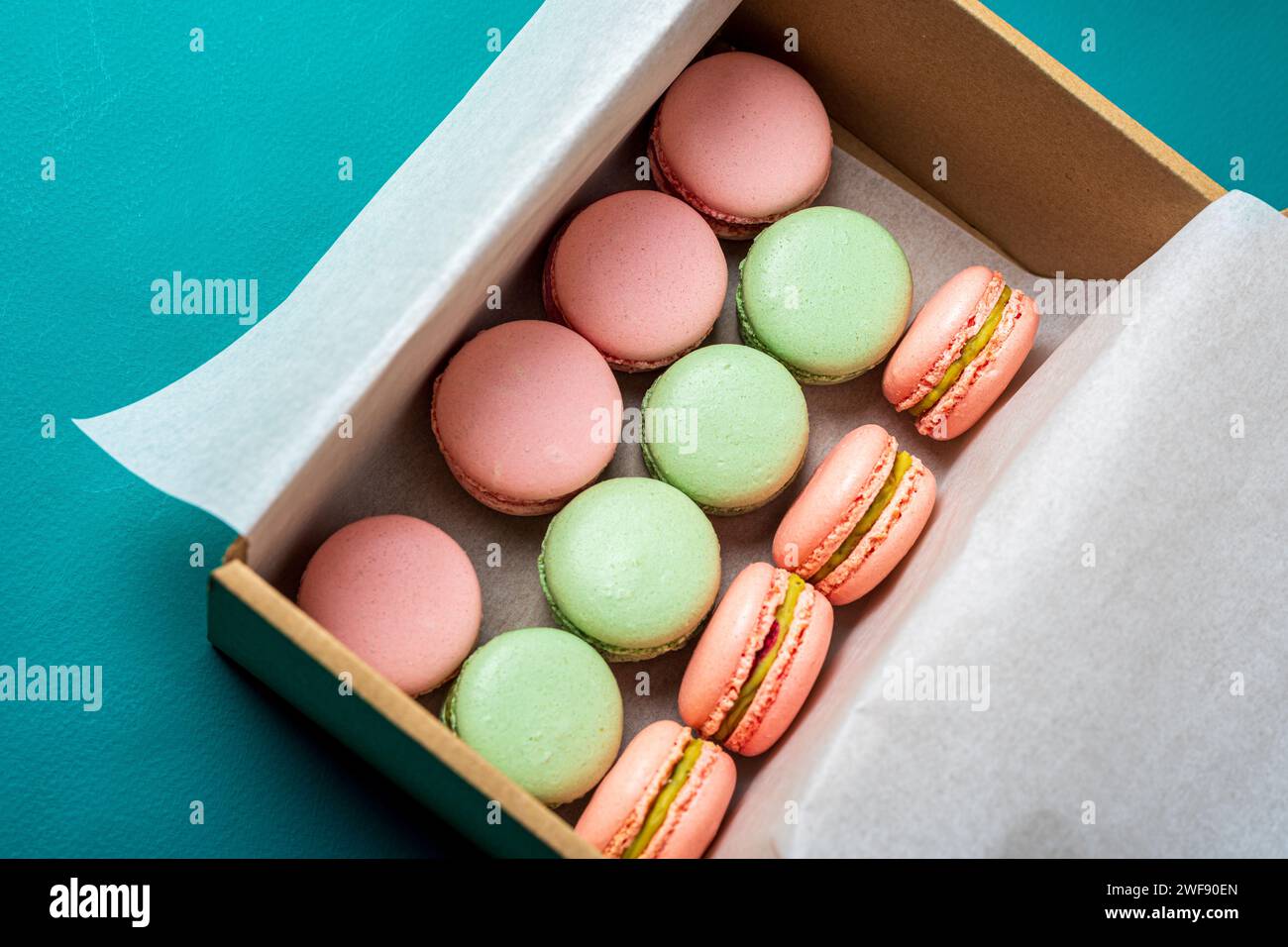 Close up colorful macarons dessert with vintage pastel tones in box ...