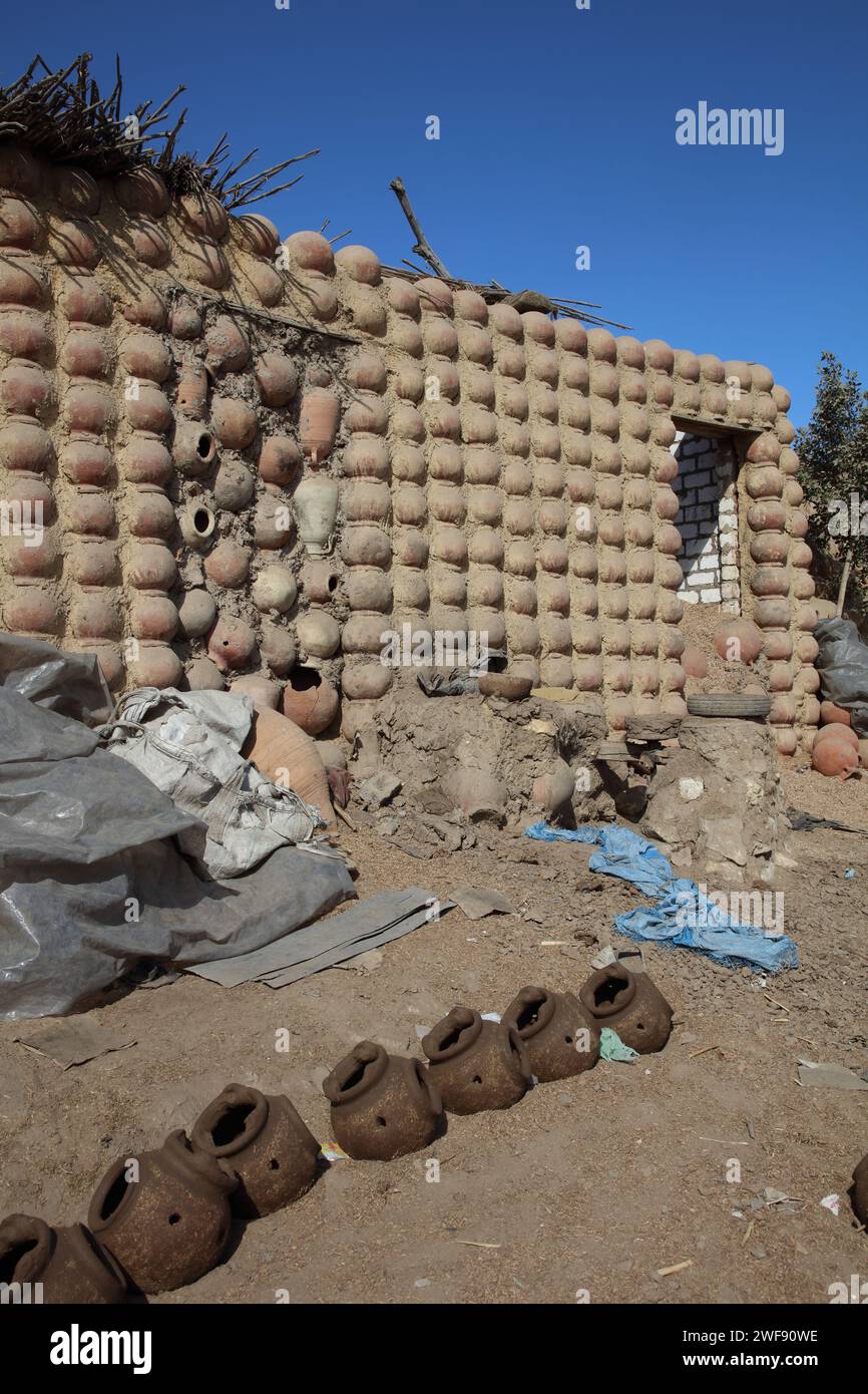 pottery, houses, rubish in a village Stock Photo - Alamy