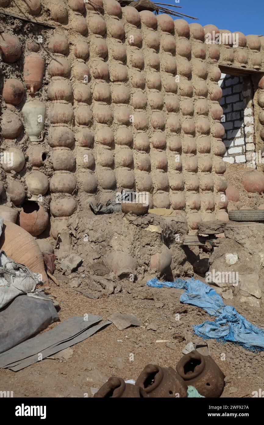 pottery, houses, rubish in a village Stock Photo - Alamy