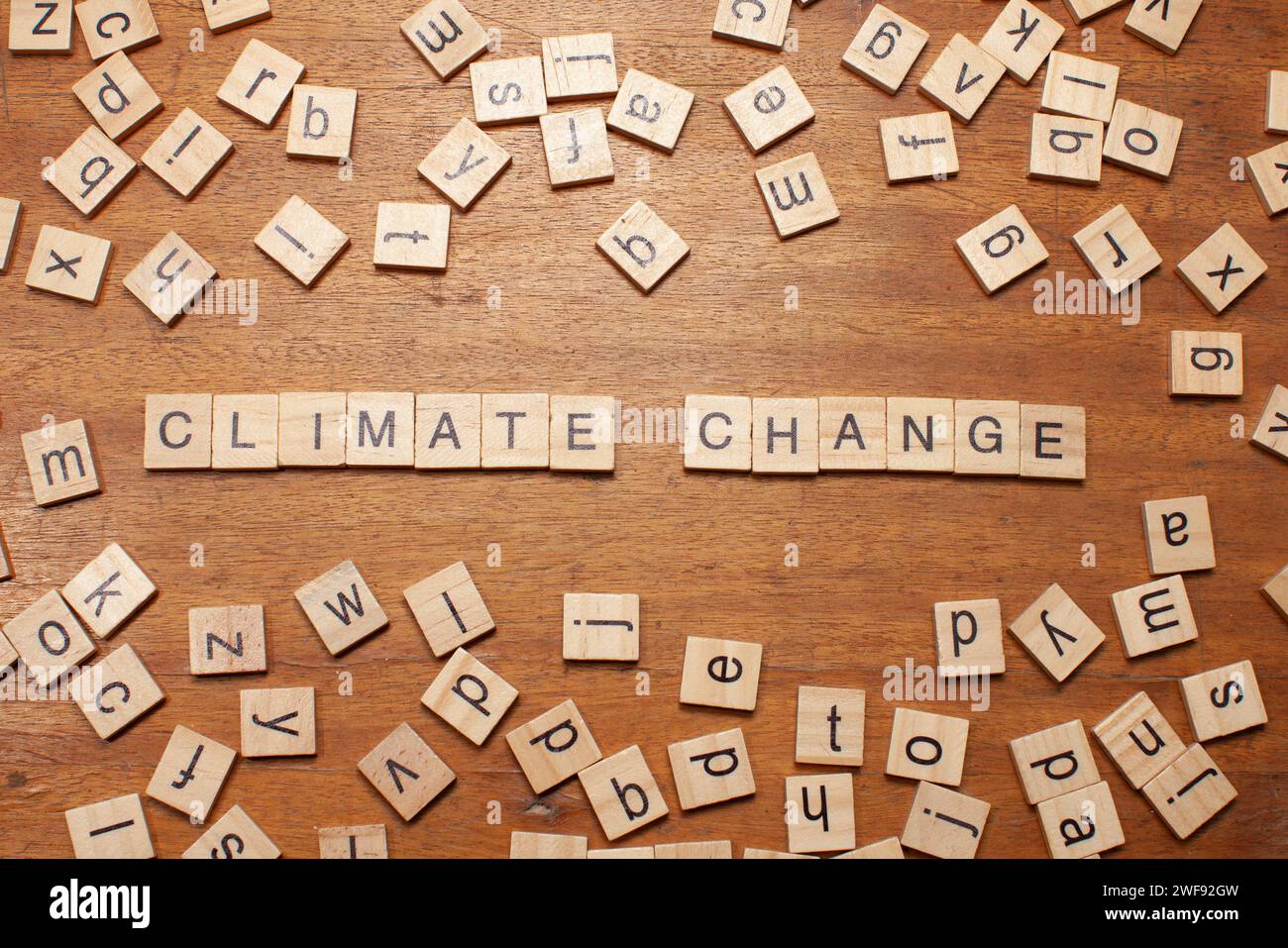 climate change letter tiles arranged on wooden board background Stock ...
