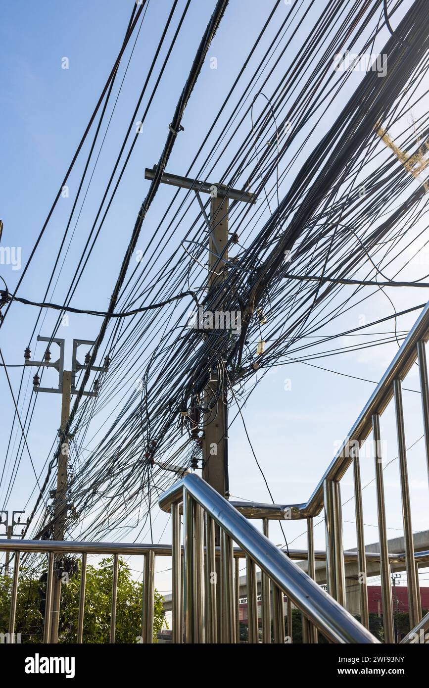 A multi-level staircase adorned with a myriad of interconnected wires ...