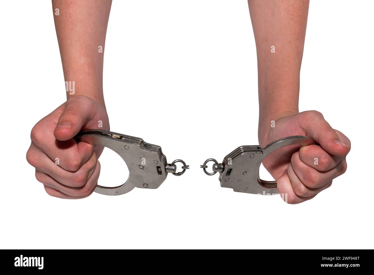 Hands tearing handcuffs on a white background. Freedom. Arrest ...