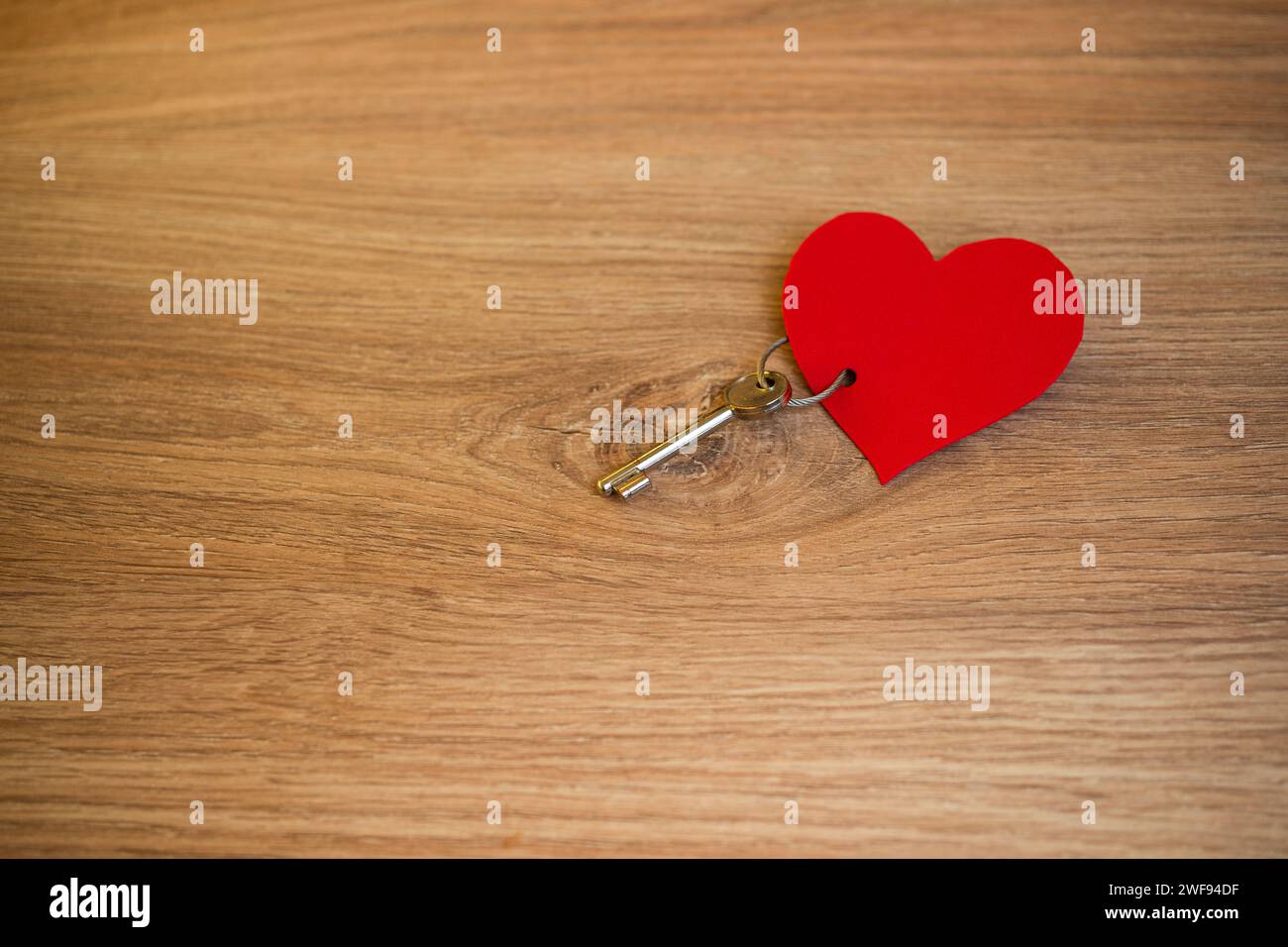 heart attached to a key, key to your heart Stock Photo - Alamy