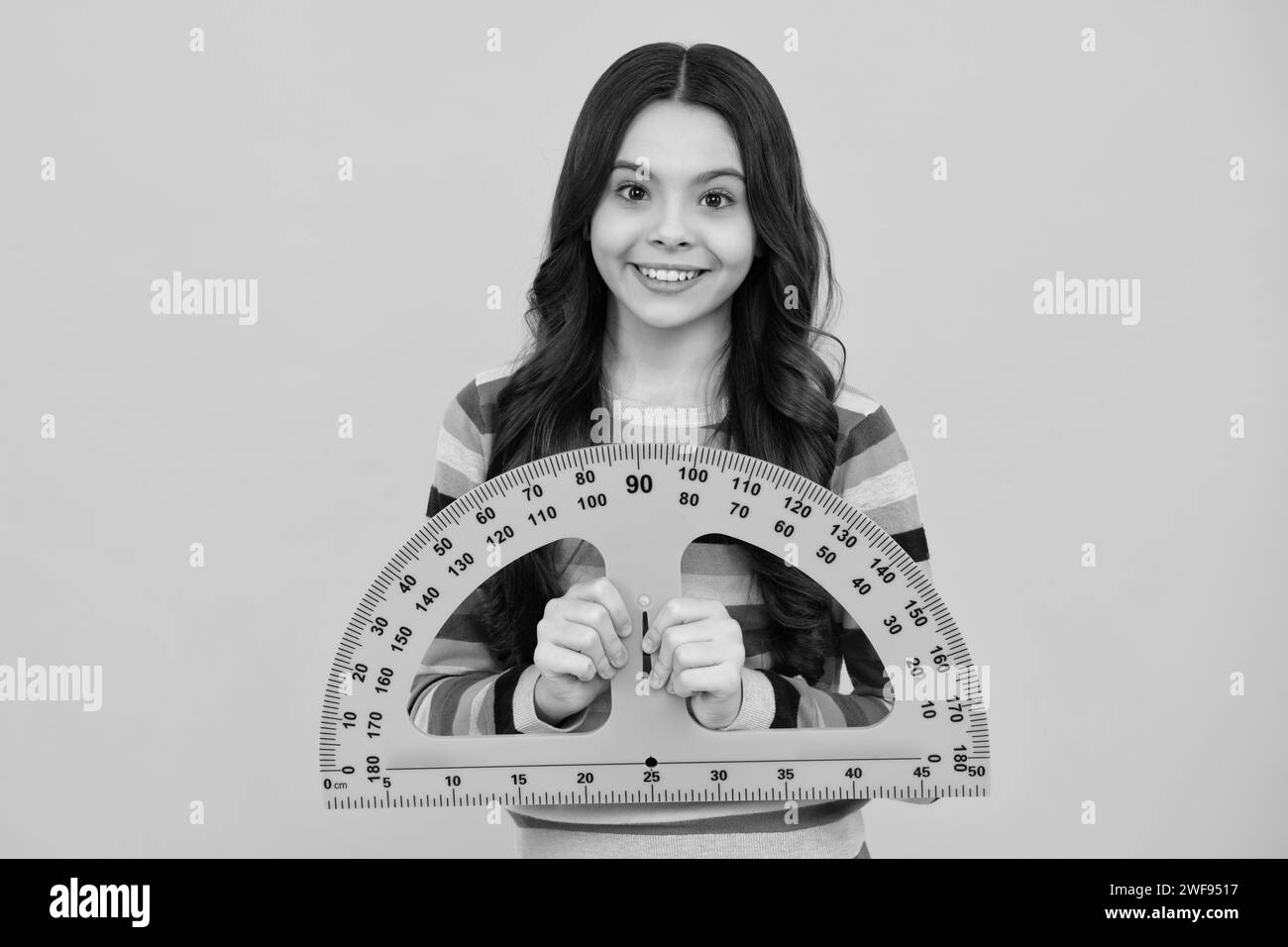 Teenager school girl study math or geometry lesson, measure the size ...